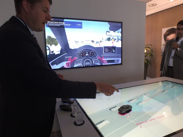 VR goggles and giant touchscreen tables: How Audi explains new car ...