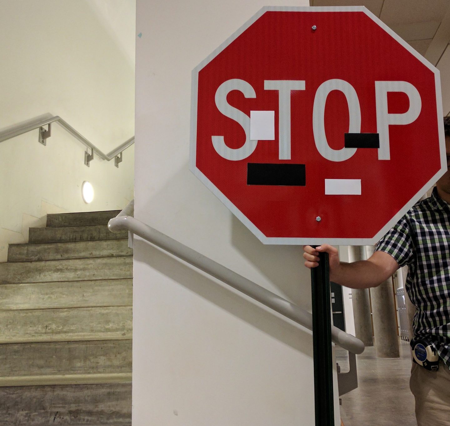Hacking street signs with stickers could confuse self-driving cars ...
