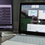 An external monitor sits next to a laptop computer.