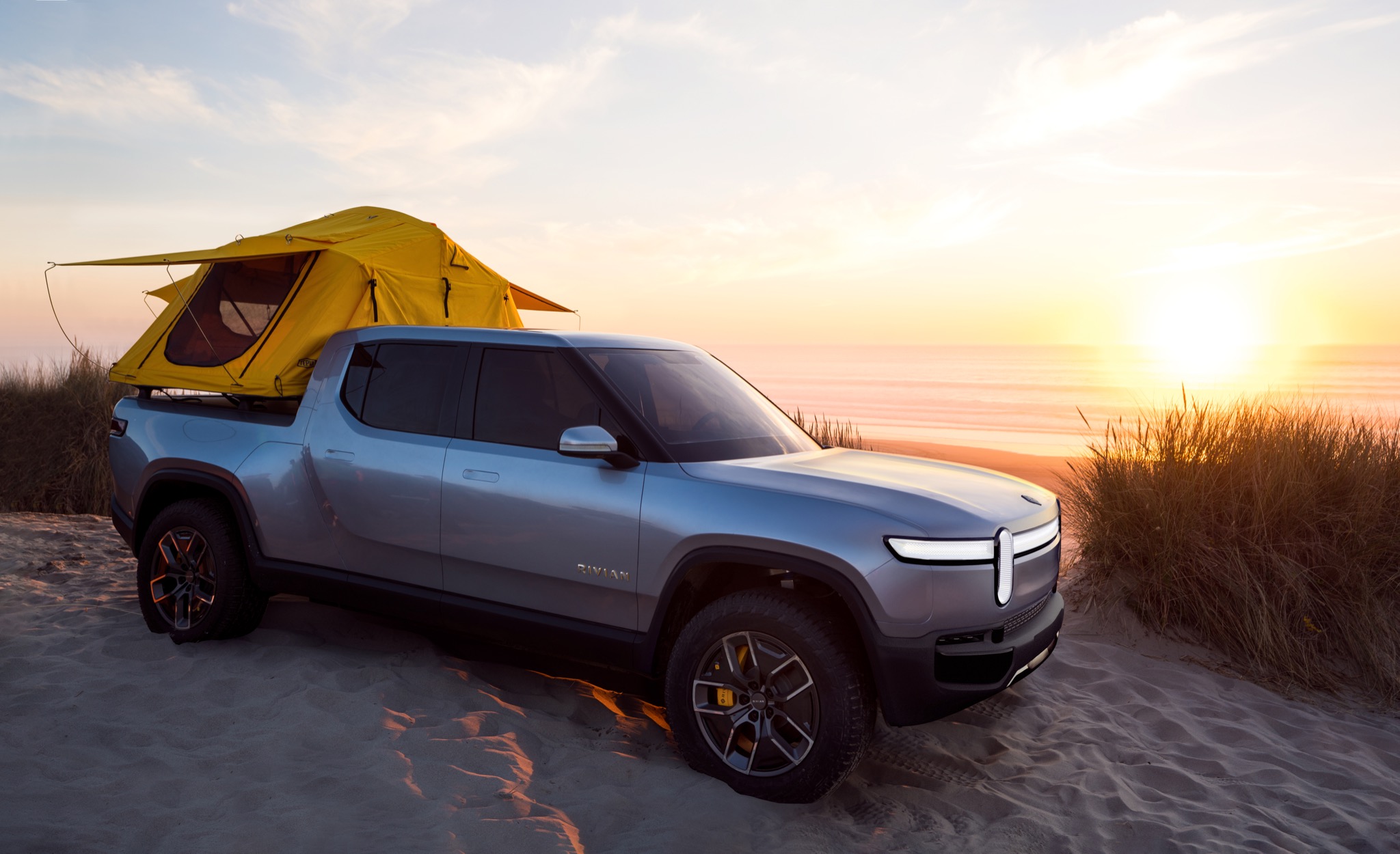Rivian debuts new US-made electric truck and SUV with 400-mile range ...