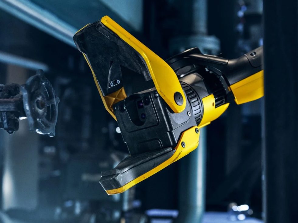 Boston Dynamics’ robot dog gets an arm attachment, self-charging ...
