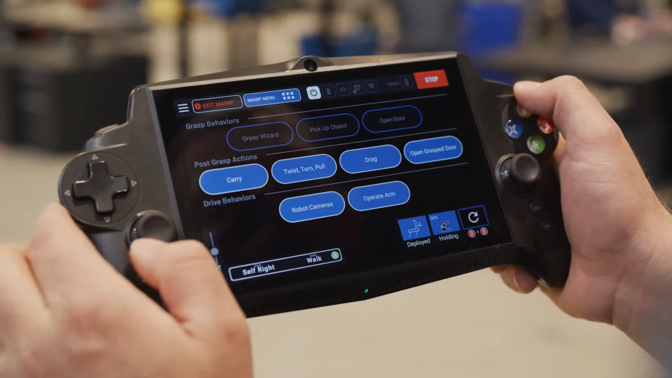 Boston Dynamics’ robot dog gets an arm attachment, self-charging ...