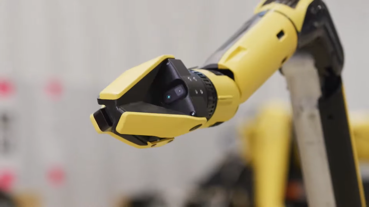 Boston Dynamics’ robot dog gets an arm attachment, self-charging ...