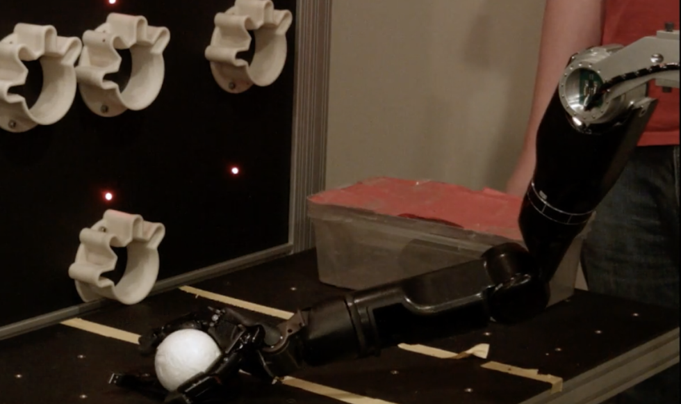 Brain implant gives robotic arm a sense of touch - Ars Technica