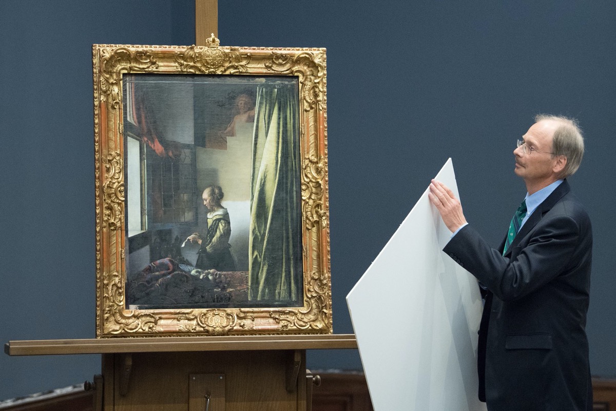 Restored Vermeer painting finally reveals hidden Cupid in background ...