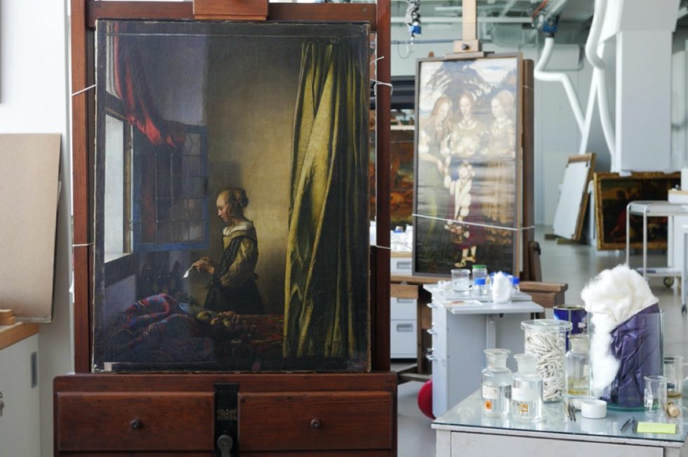 Restored Vermeer painting finally reveals hidden Cupid in background ...