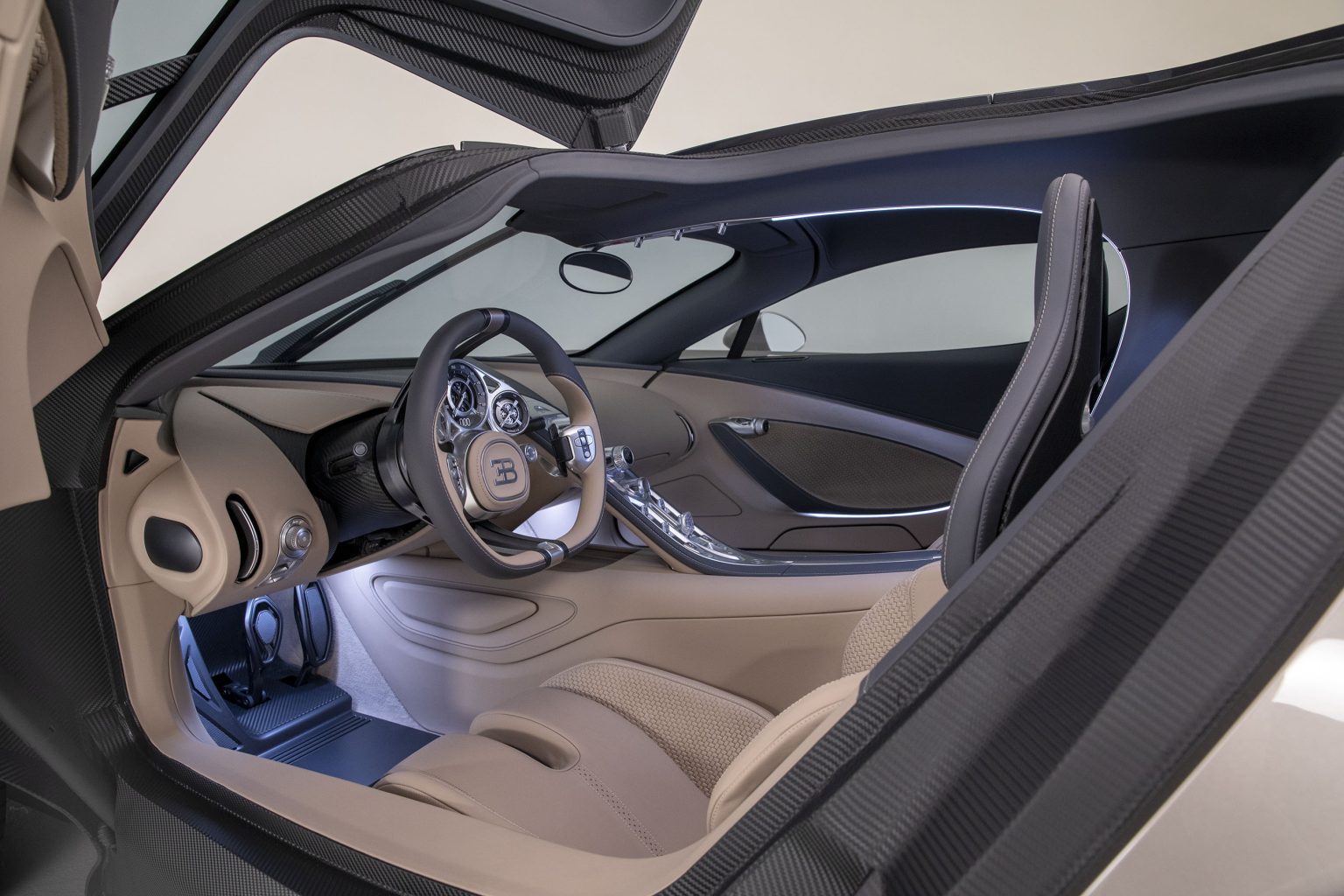 Bugatti’s new hypercar loses the turbos for a screaming V16 hybrid ...