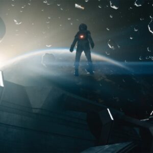 still from Apple TV + series Foundation, showing an astronaut standing on a planet, space debris swimming around, while looking at a distant moon.