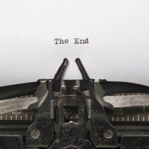 Photo of a typewriter that has typed out "The End" on a piece of paper.