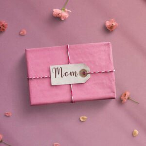 Photo of a small wrapped box with "Mom" label affixed