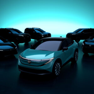 A Nissan Leaf surrounded by other Nissan concepts that are in shadow