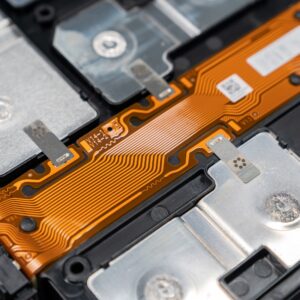 Detailed look at lithium-based battery cells (Lithium iron phosphate, LFP) for electric vehicles. Focus on wire connections, circuit integration, and modular design. Reflects innovation in electric transport, environmental conservation, and power storage systems.