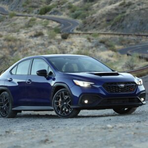 A blue Subaru WRX in the desert