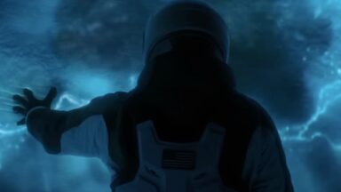 shadowy back of a person in a spacesuit reaching out one hand to a glowing blueish mass in front it them